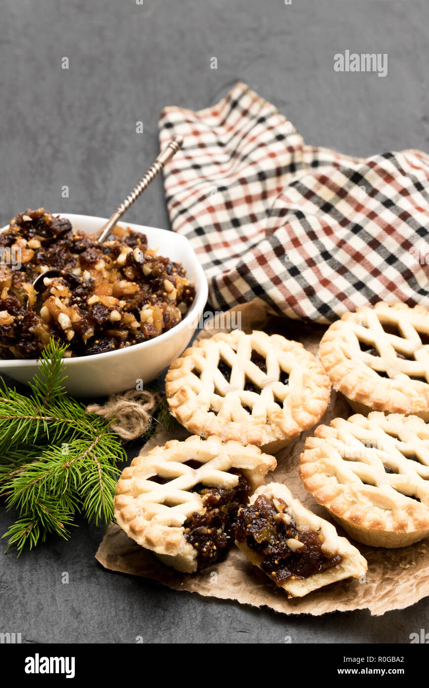 Mince pie group on black stone background Stock Photo - Alamy