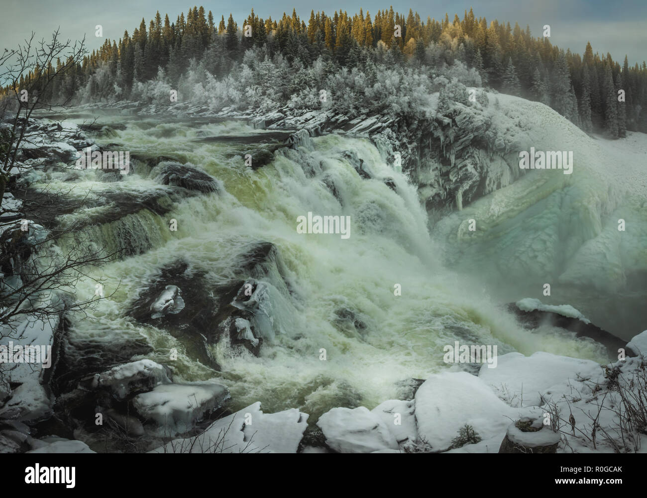 Frozen waterfall Tannforsen. Winter scenery and ice forming on this ...