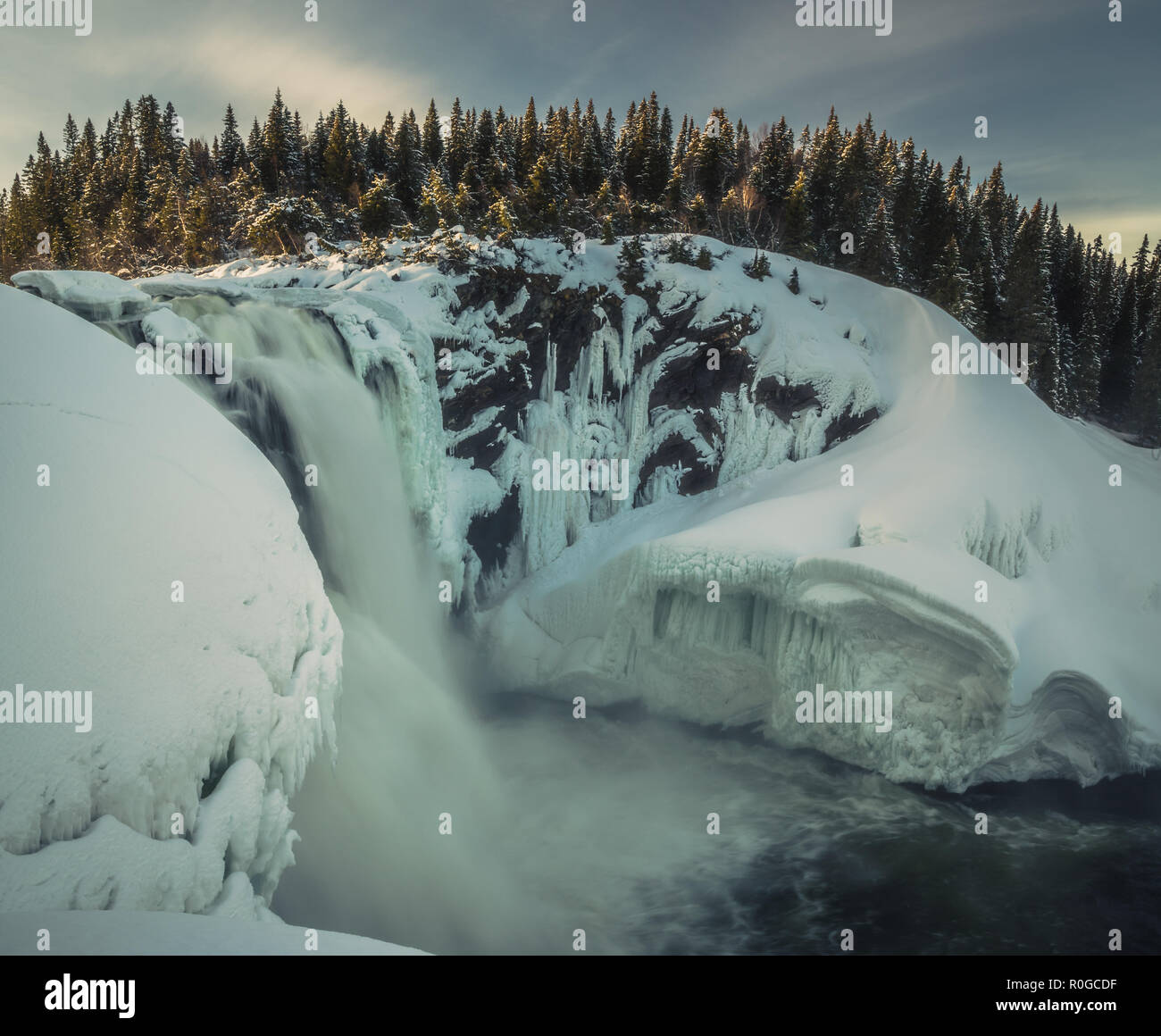 Frozen waterfall Tannforsen. Winter scenery and ice forming on this ...