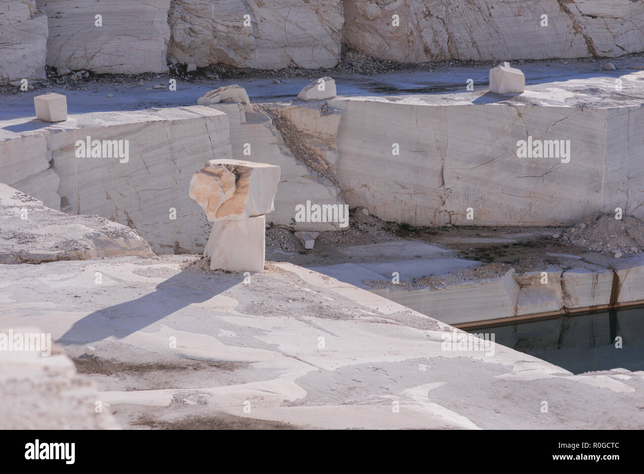 Marble quarry landscape in the mountains with a turquoise lake water ...