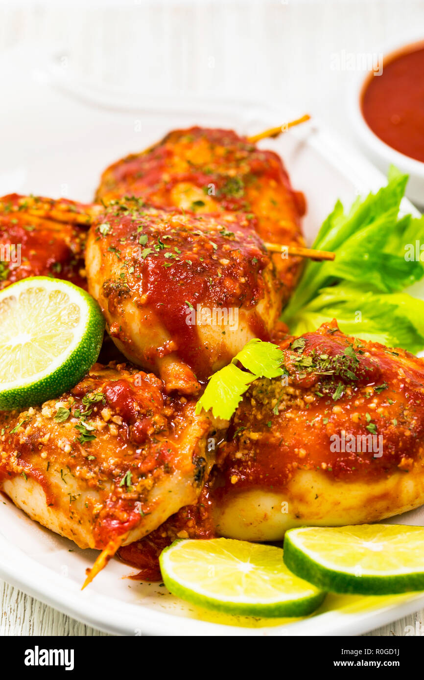 Calamari. Stuffed Squid Tubes with Tomato Sauce Stock Photo - Alamy