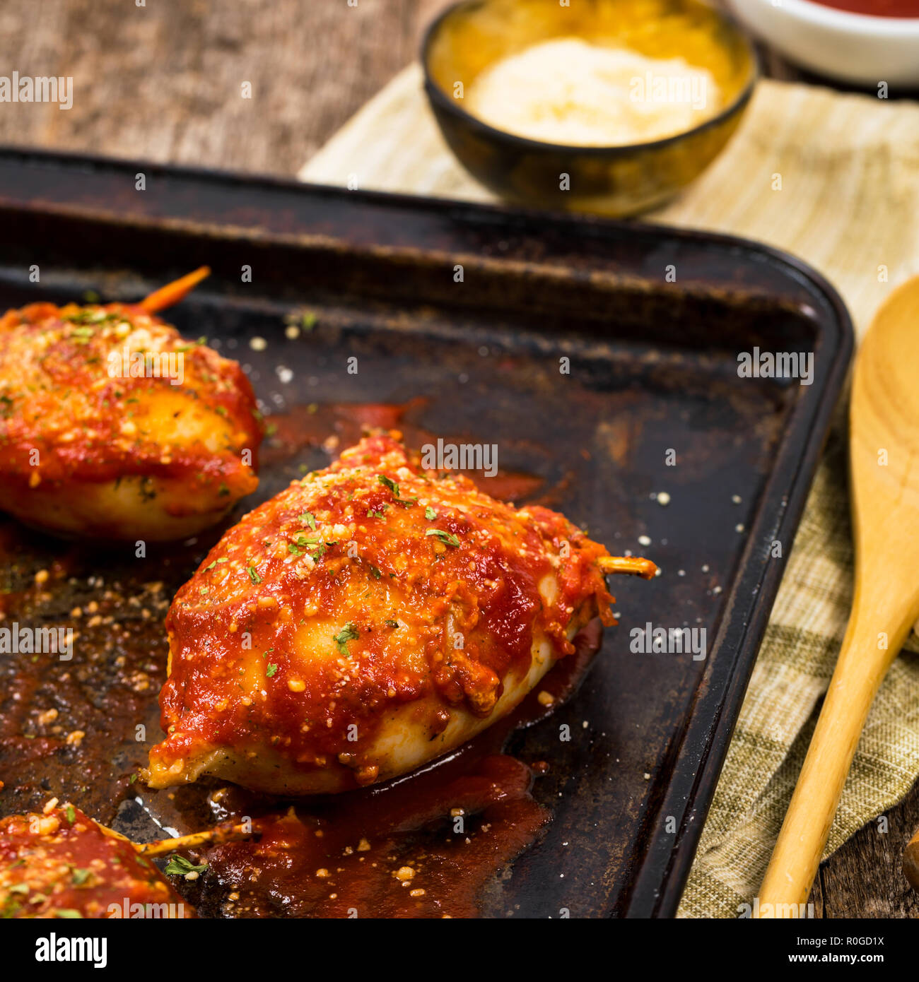 Calamari. Stuffed Squid Tubes with Tomato Sauce Stock Photo - Alamy