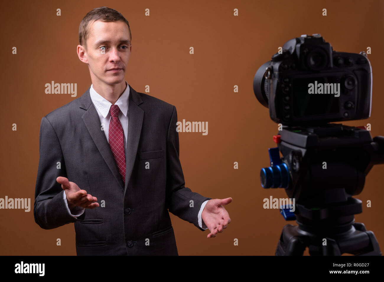 Young man explaining arms hi-res stock photography and images - Alamy