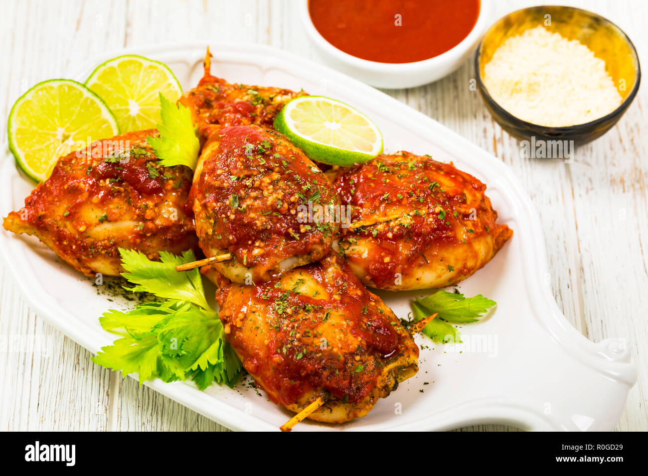 Calamari. Stuffed Squid Tubes with Tomato Sauce Stock Photo - Alamy