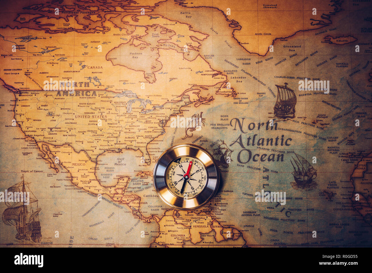 Columbus day and world map with compass Stock Photo - Alamy