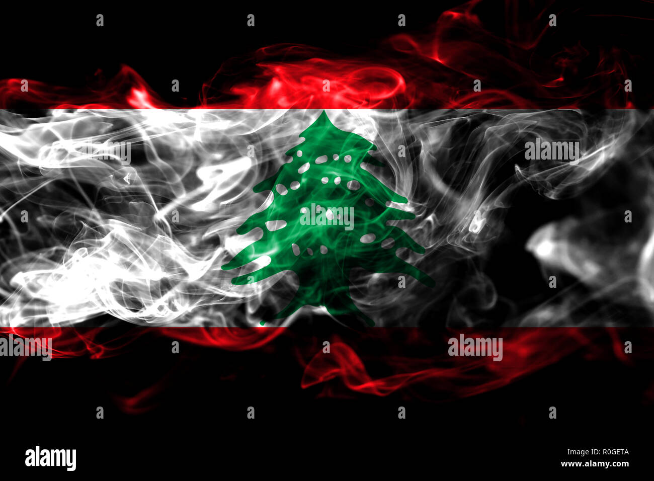 National flag of Lebanon made from colored smoke isolated on black ...