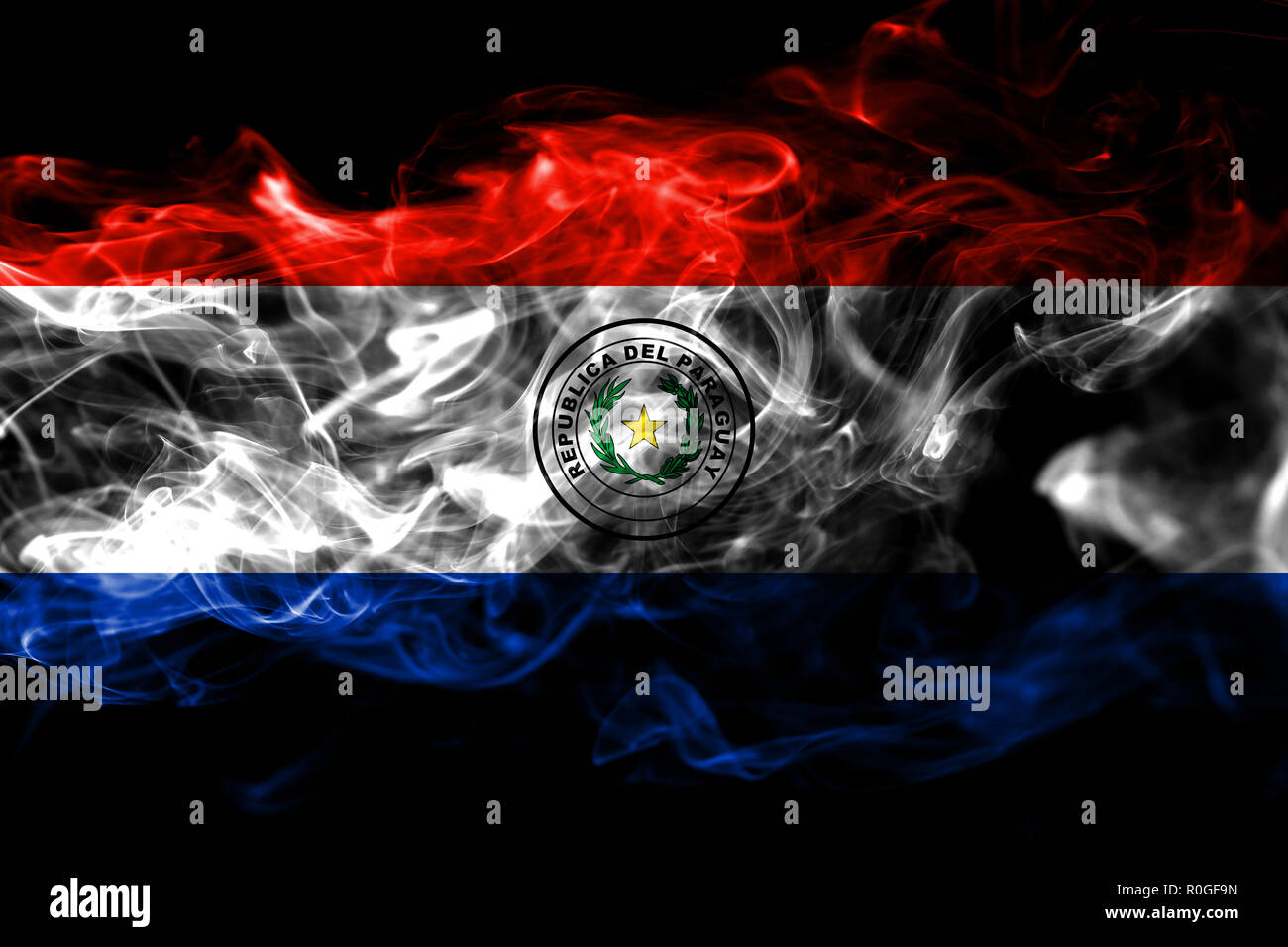 National flag of Paraguay made from colored smoke isolated on black ...