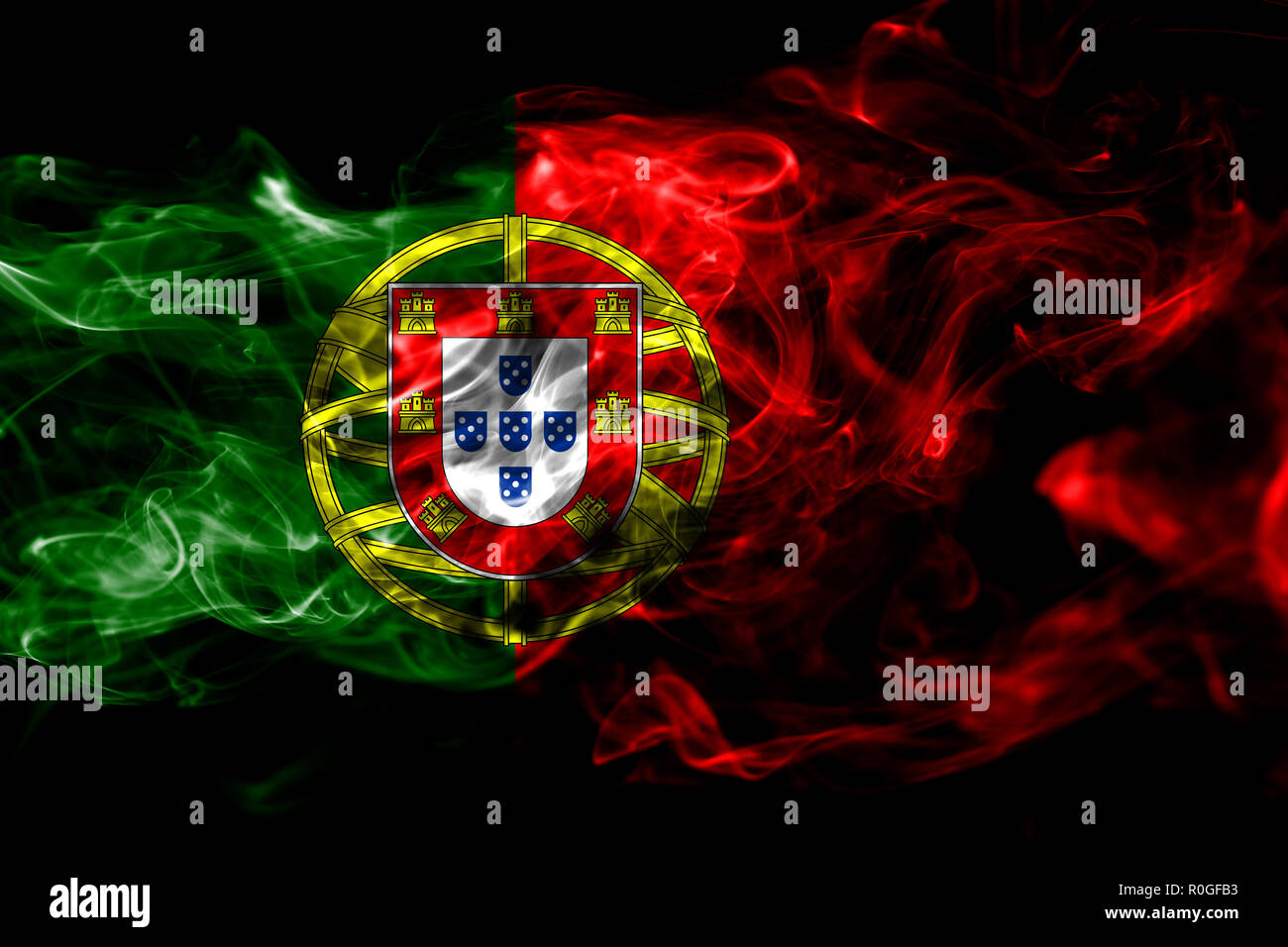 National flag of Portugal made from colored smoke isolated on black ...