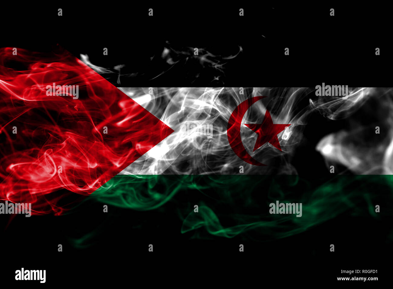 National flag of Sahrawi made from colored smoke isolated on black ...