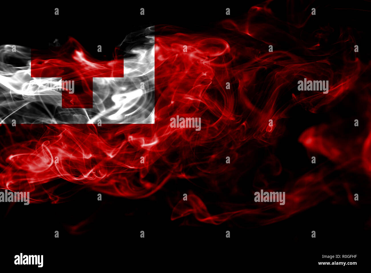 National flag of Tonga made from colored smoke isolated on black ...