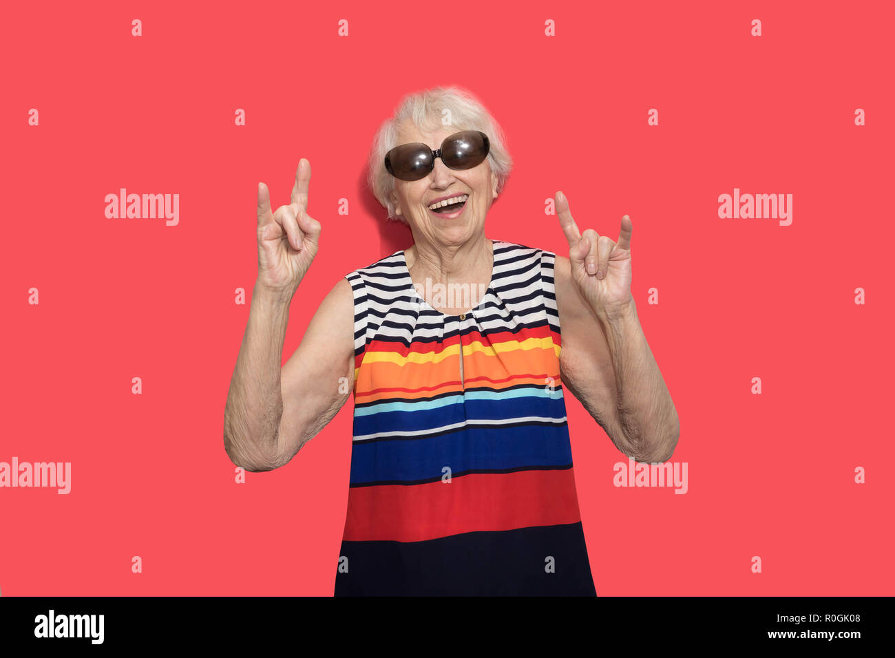 Woman making hand gesture rock hi-res stock photography and images - Alamy