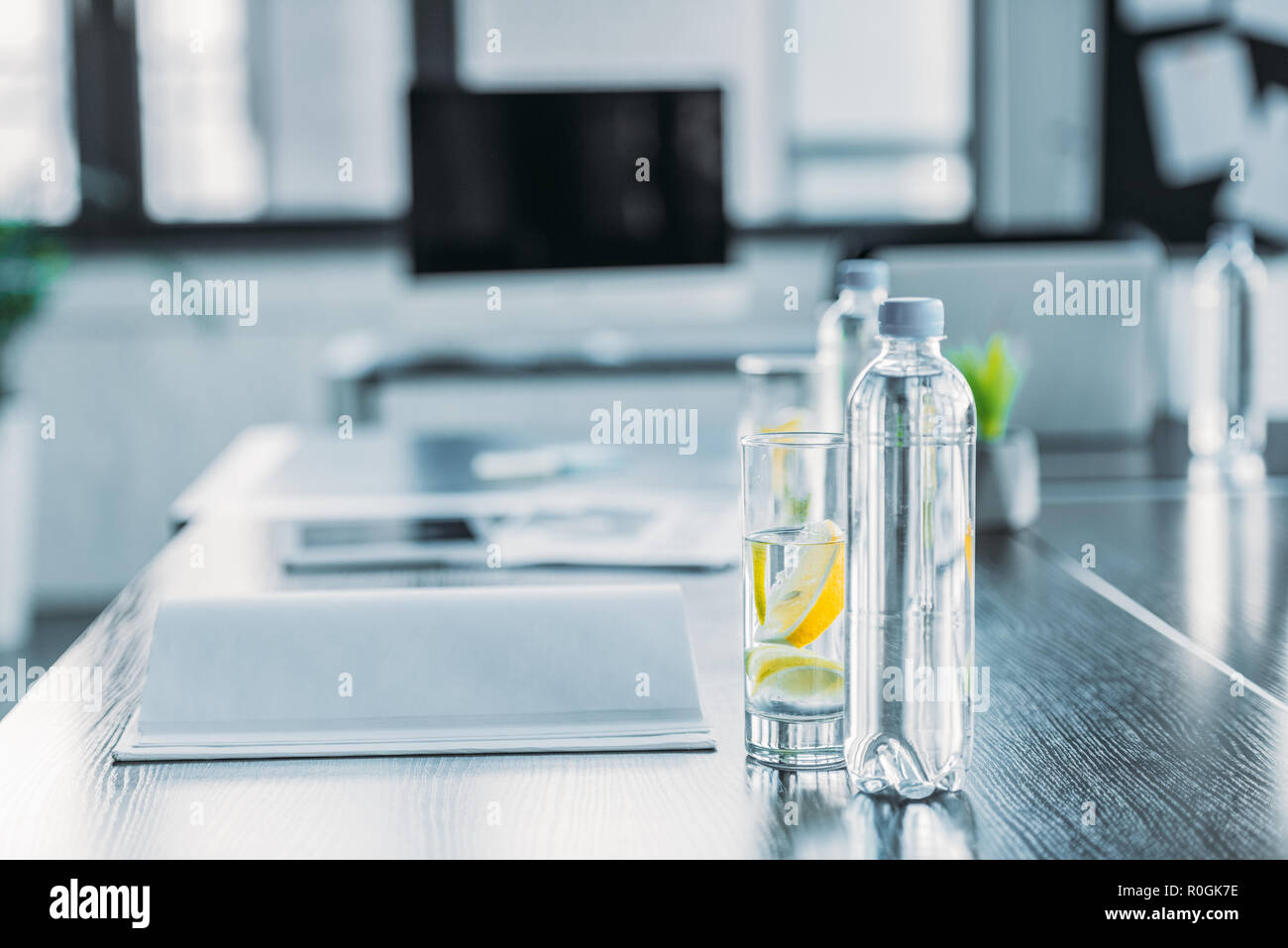 bottles and glasses with antioxidant drink for business meeting in ...