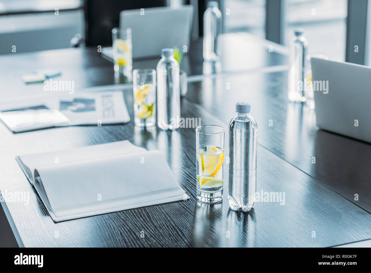 bottles and glasses with antioxidant drink for business meeting on ...