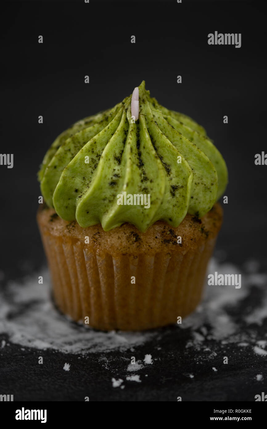 Tasty mini cupcakes on a vintage background, sweet dessert for ...