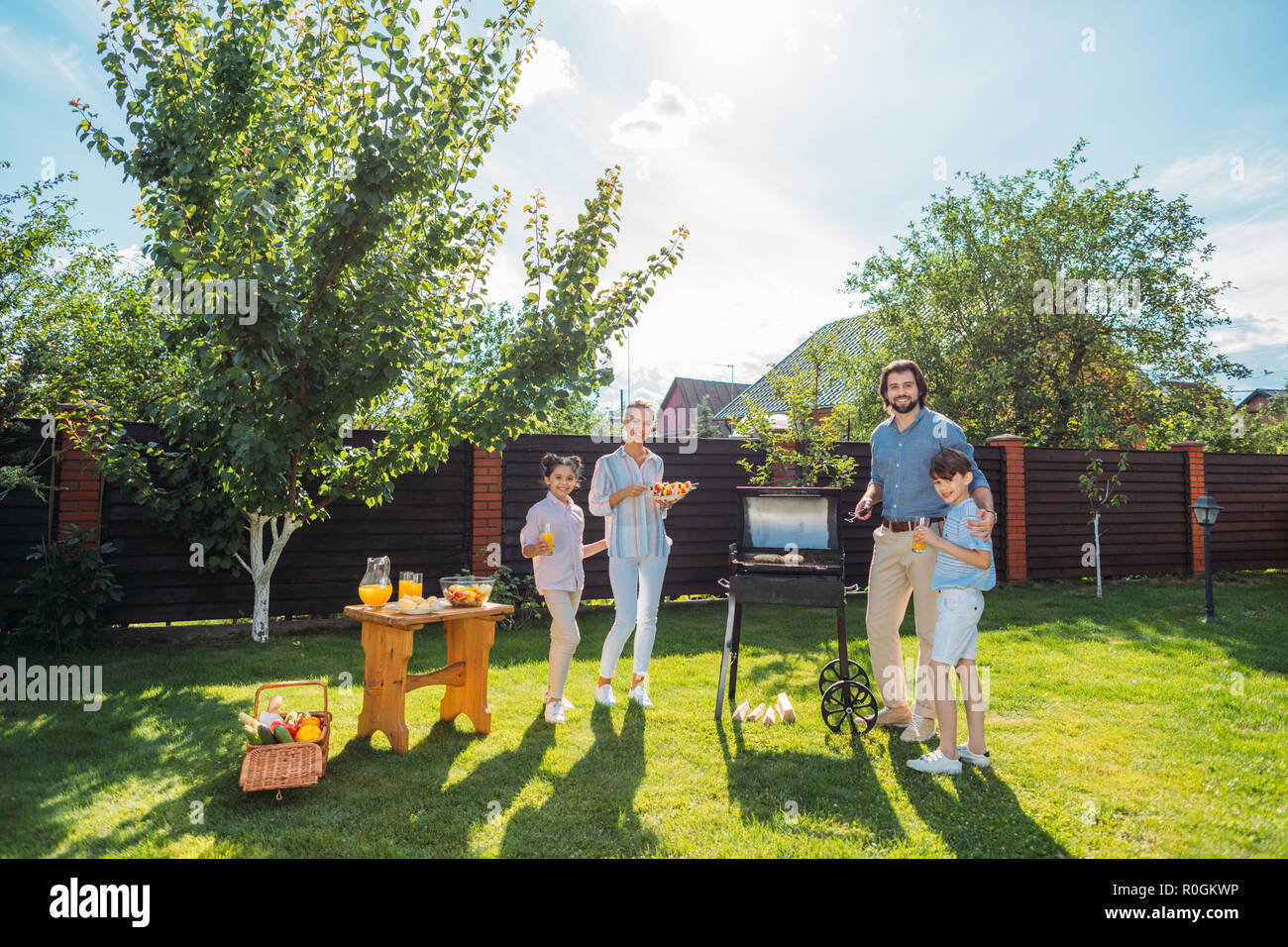 Family having barbecue hi-res stock photography and images - Alamy
