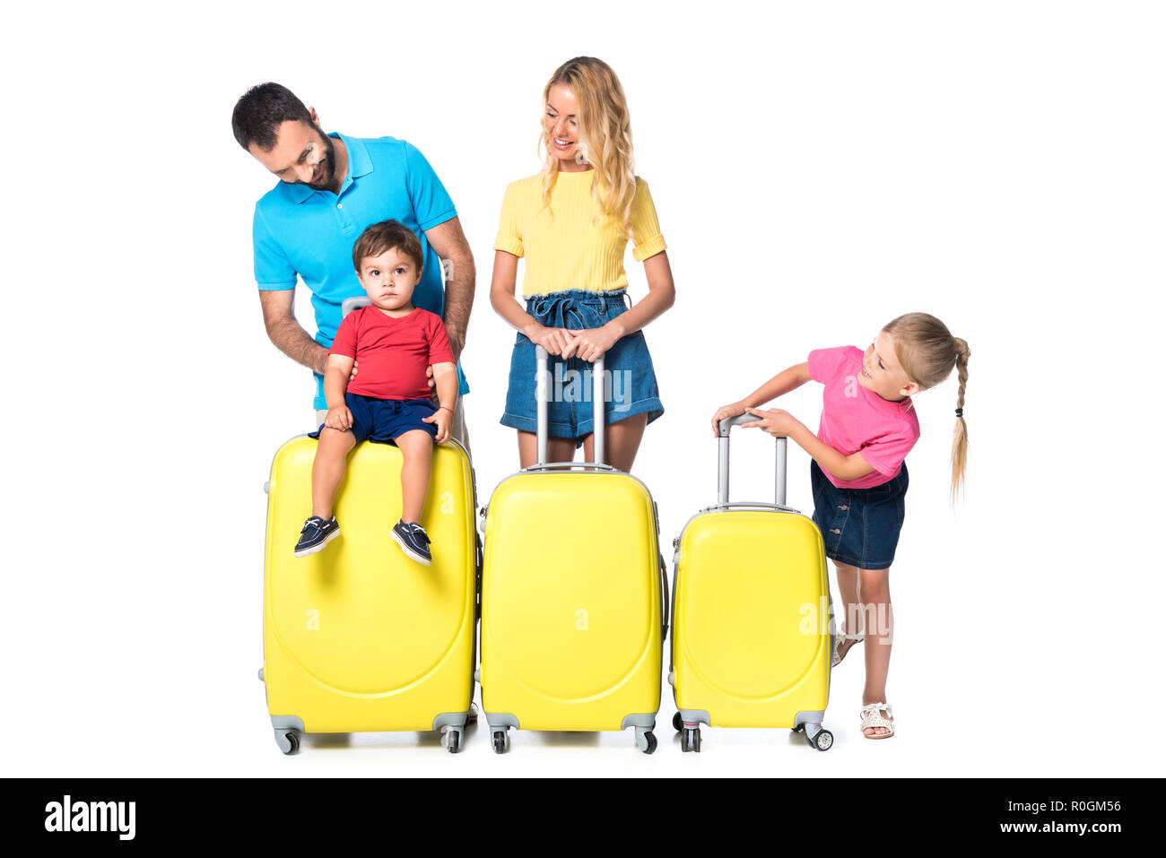 family with yellow baggage isolated on white Stock Photo - Alamy