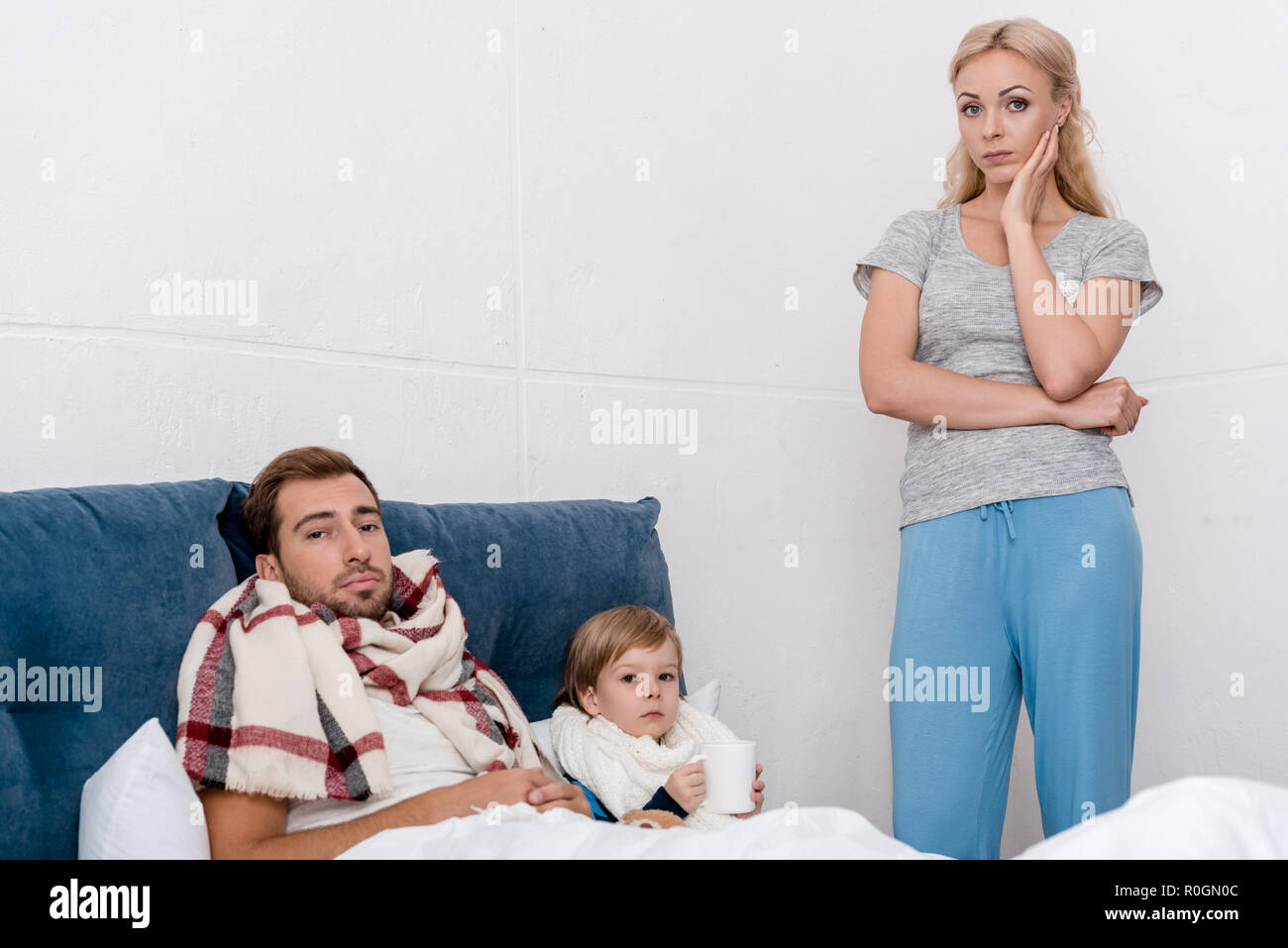 Sick woman in bed, looking at camera hi-res stock photography and ...