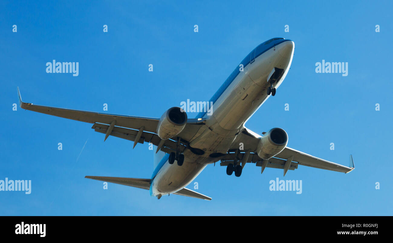 Large passenger airplane taking off from airport during day Stock Photo ...
