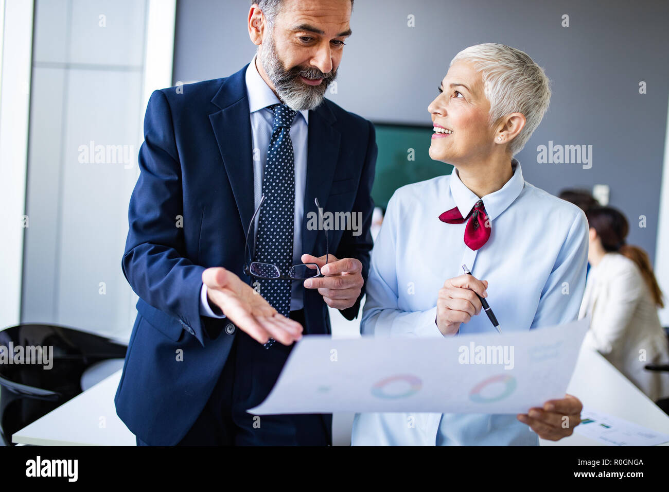 Two happy businesspeople using hi-res stock photography and images - Alamy
