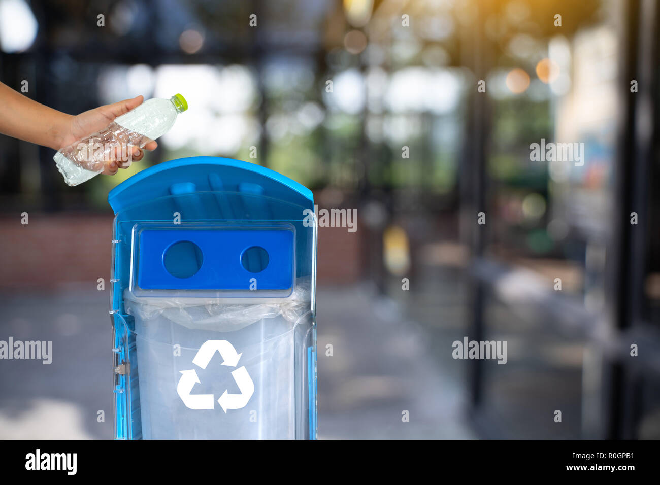 man hand putting plastic reuse for recycling concept environmental ...