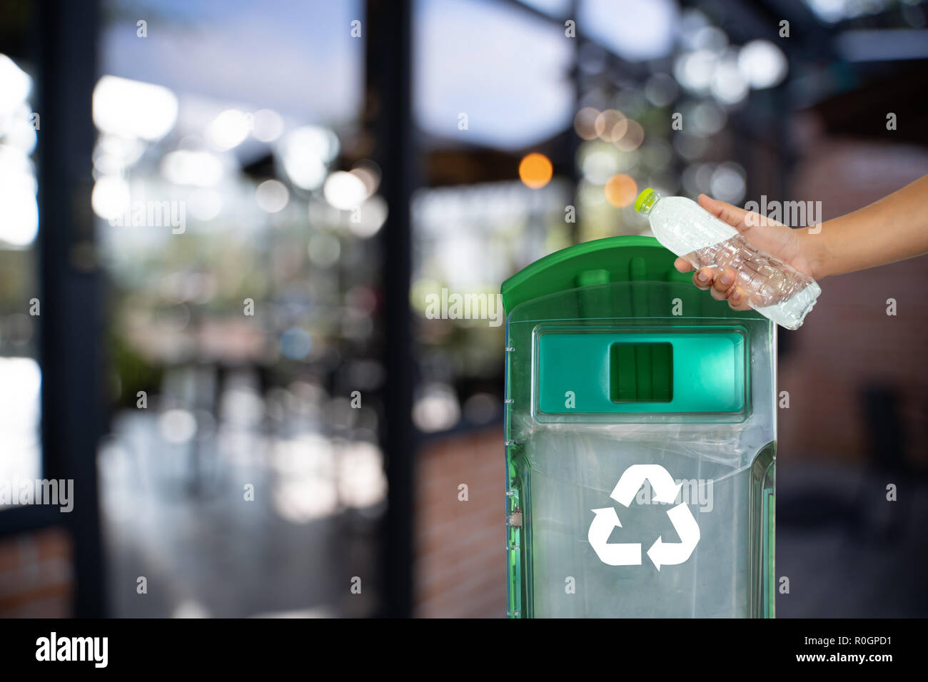 man hand putting plastic reuse for recycling concept environmental ...