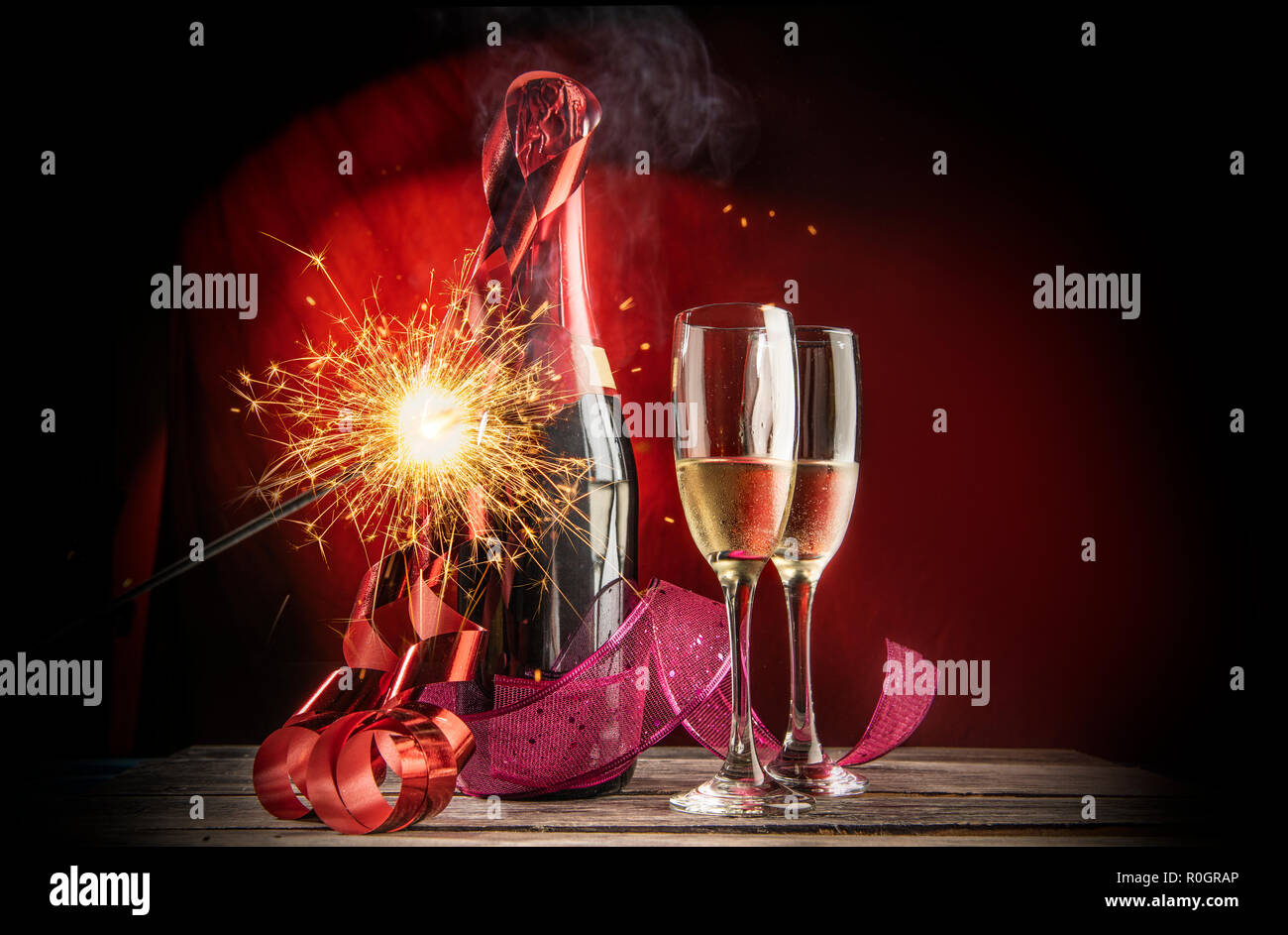 Party or event celebration with champagne and fireworks over bright ...