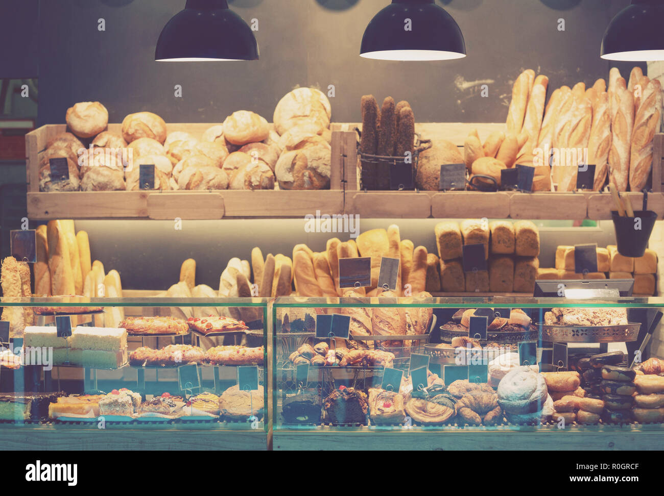 Modern bakery with assortment of bread, cakes and buns Stock Photo - Alamy