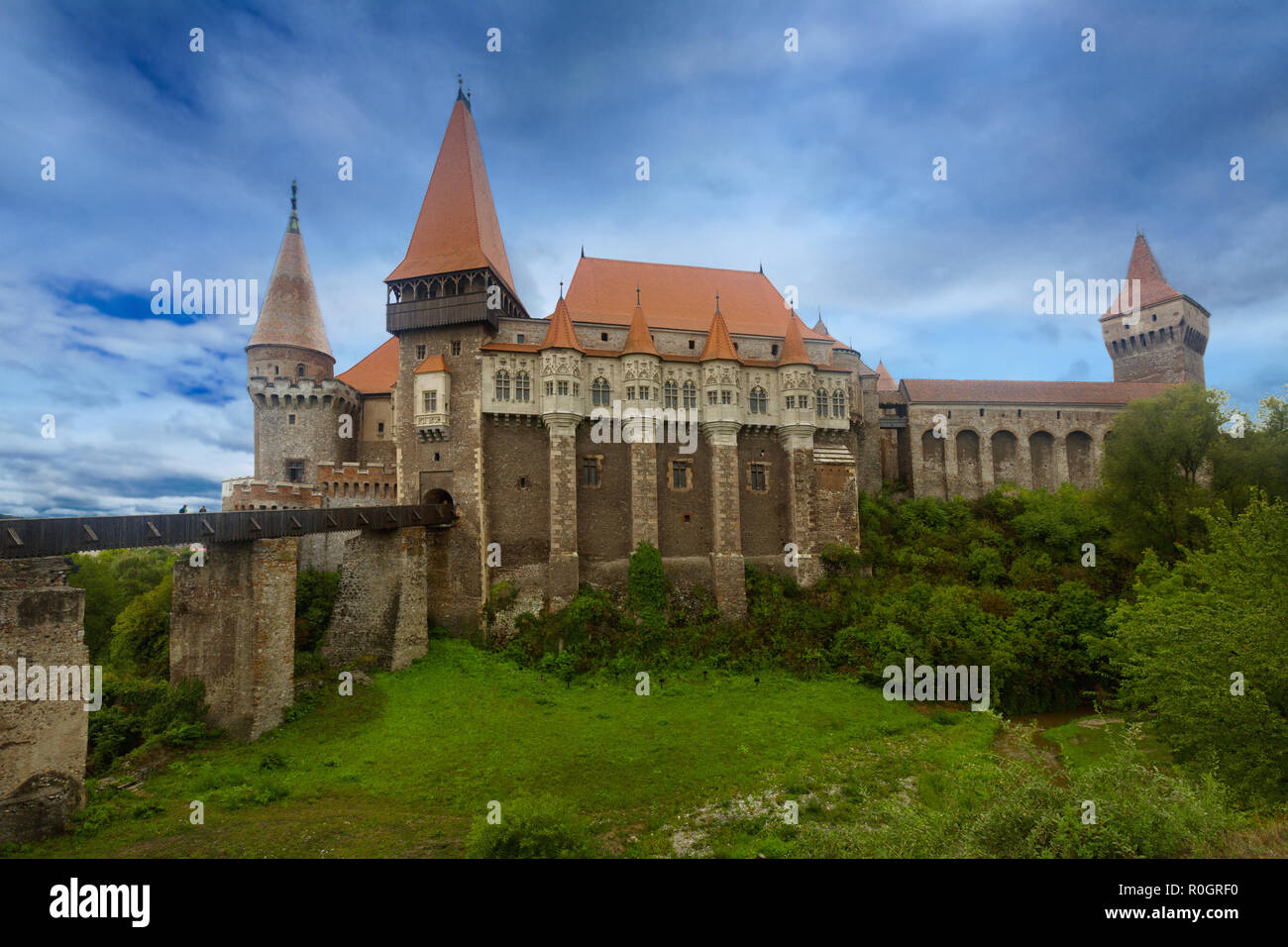 Impressive landscape with medieval Corvin Castle on elevated rock ...