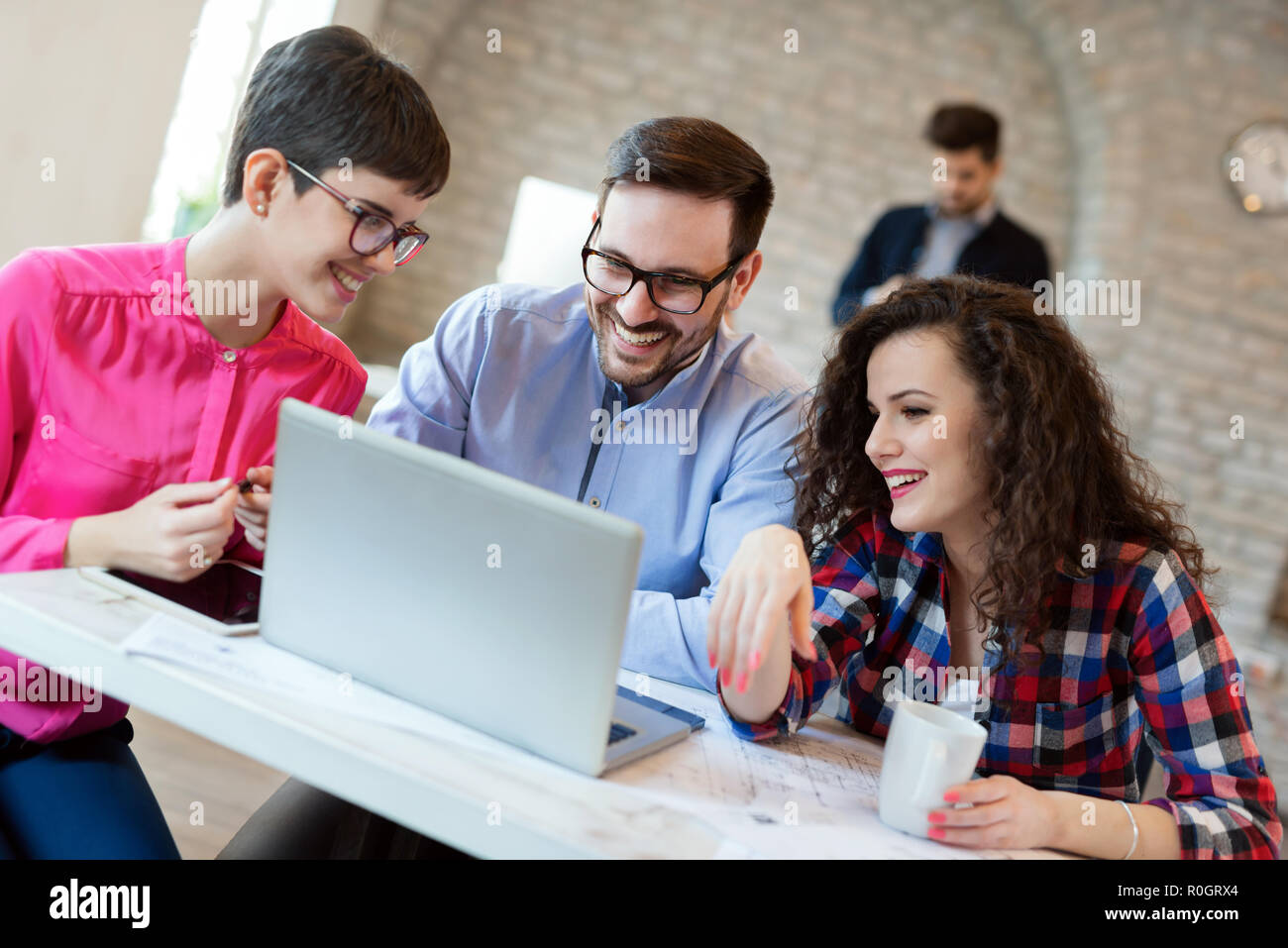Company employees working in office Stock Photo - Alamy