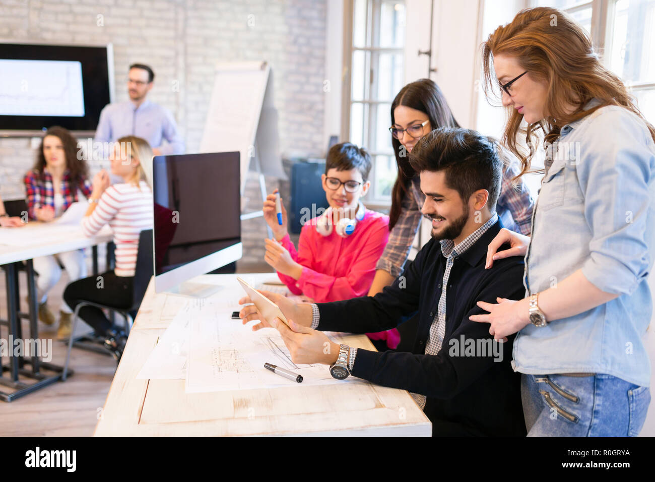 Company employees working in office Stock Photo - Alamy