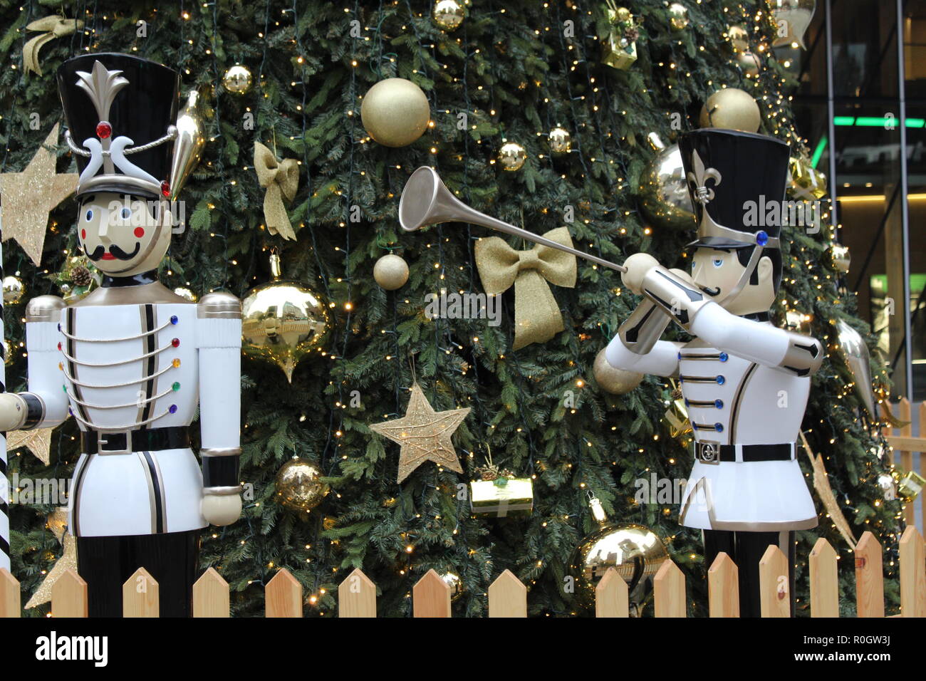 Christmas tree with gold decorations and white toy soldiers Stock Photo ...