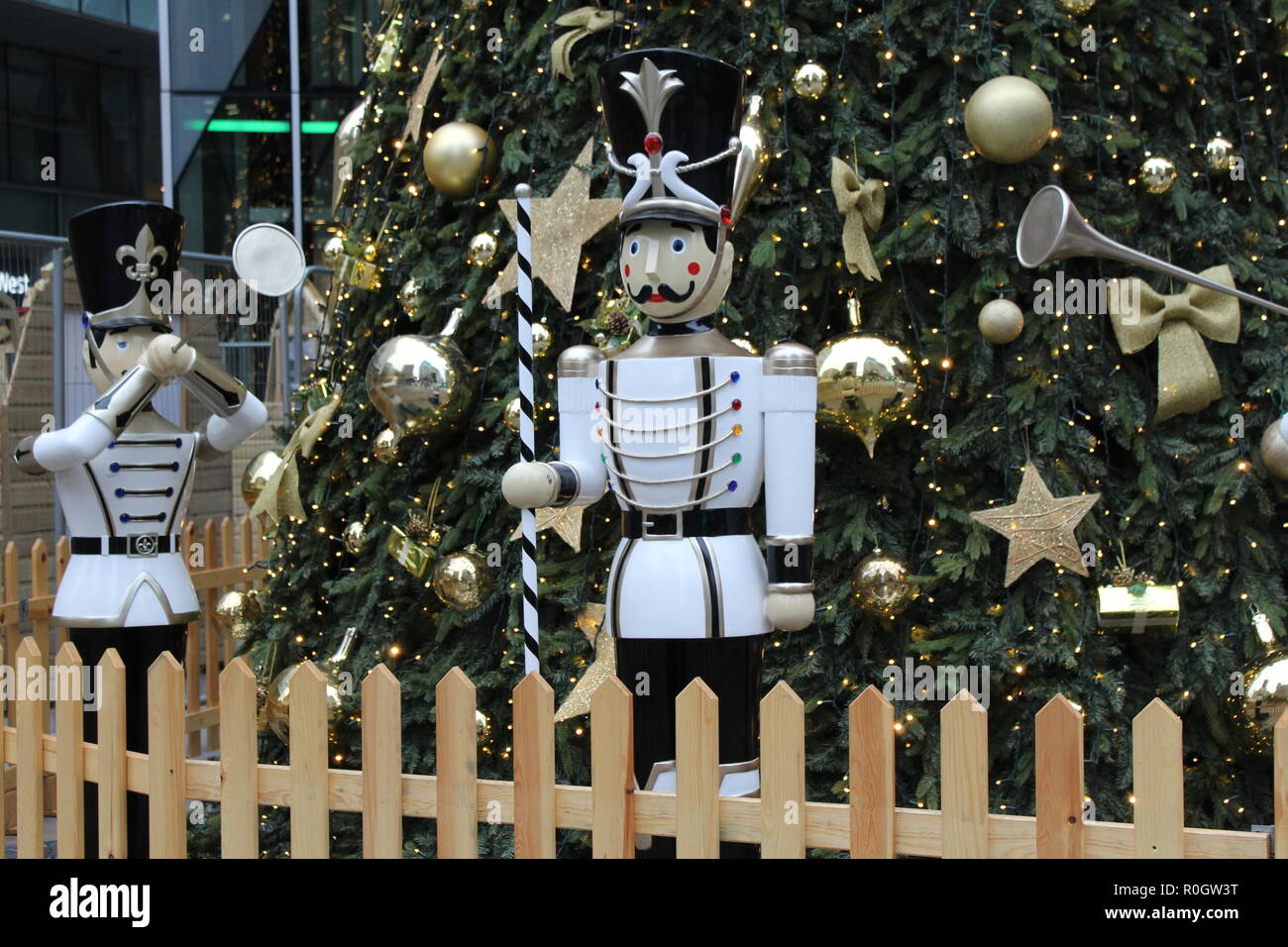 Christmas tree with gold decorations and white toy soldiers Stock Photo ...