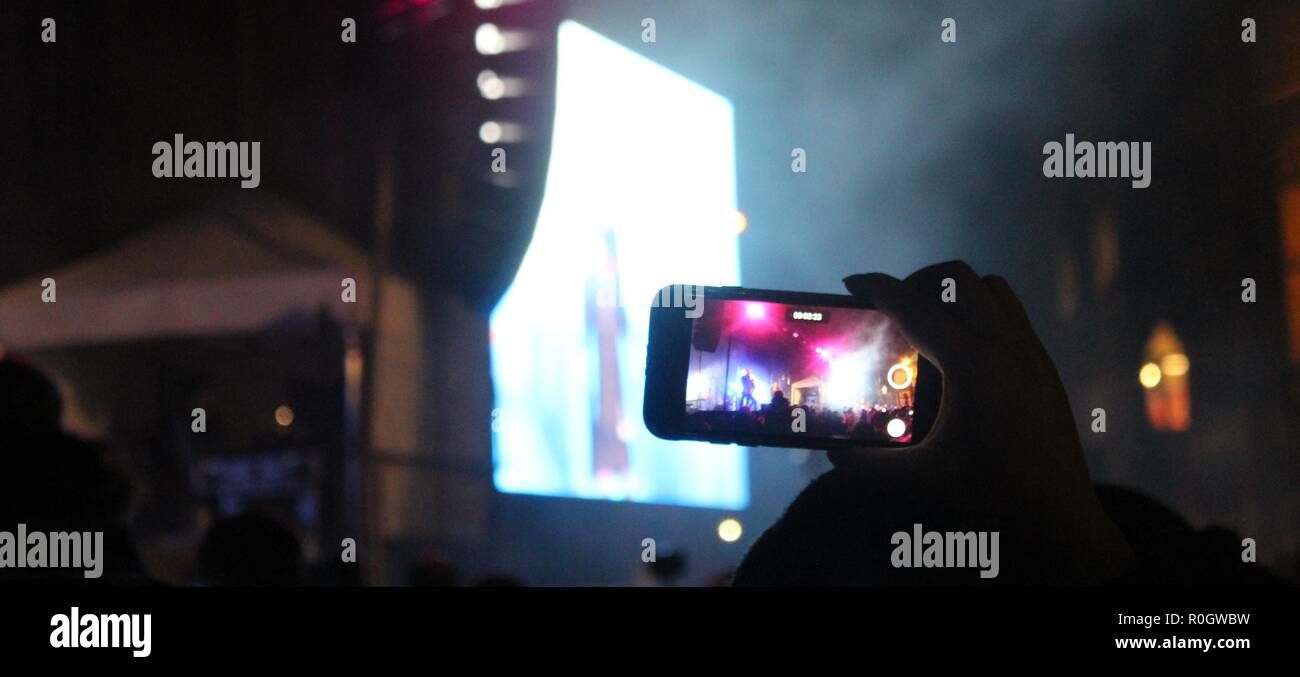 Smart phone at a music concert - Watching a performance through a cell ...