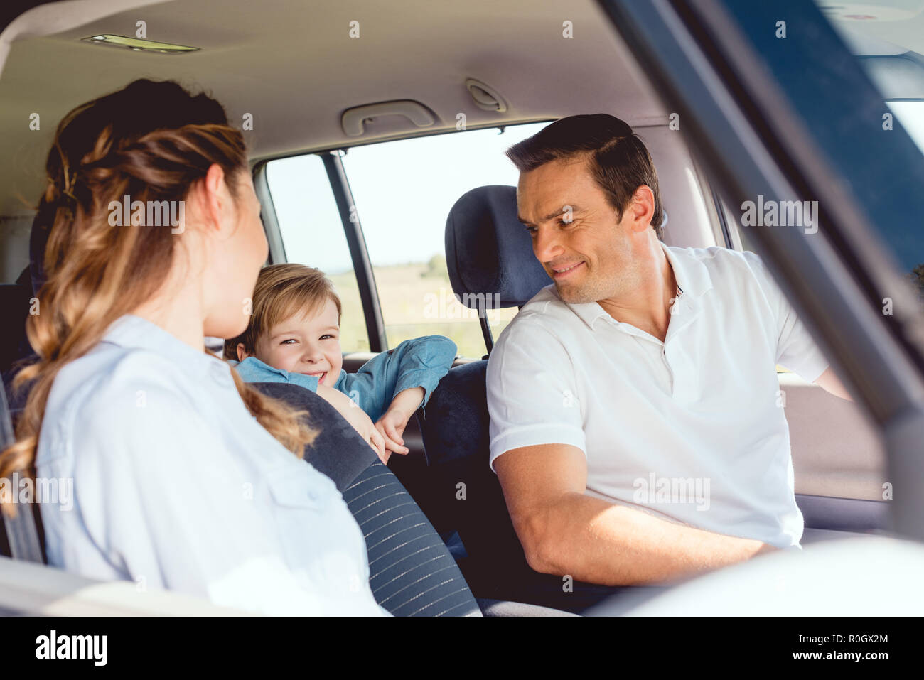 beautiful family riding car together and having fun Stock Photo - Alamy