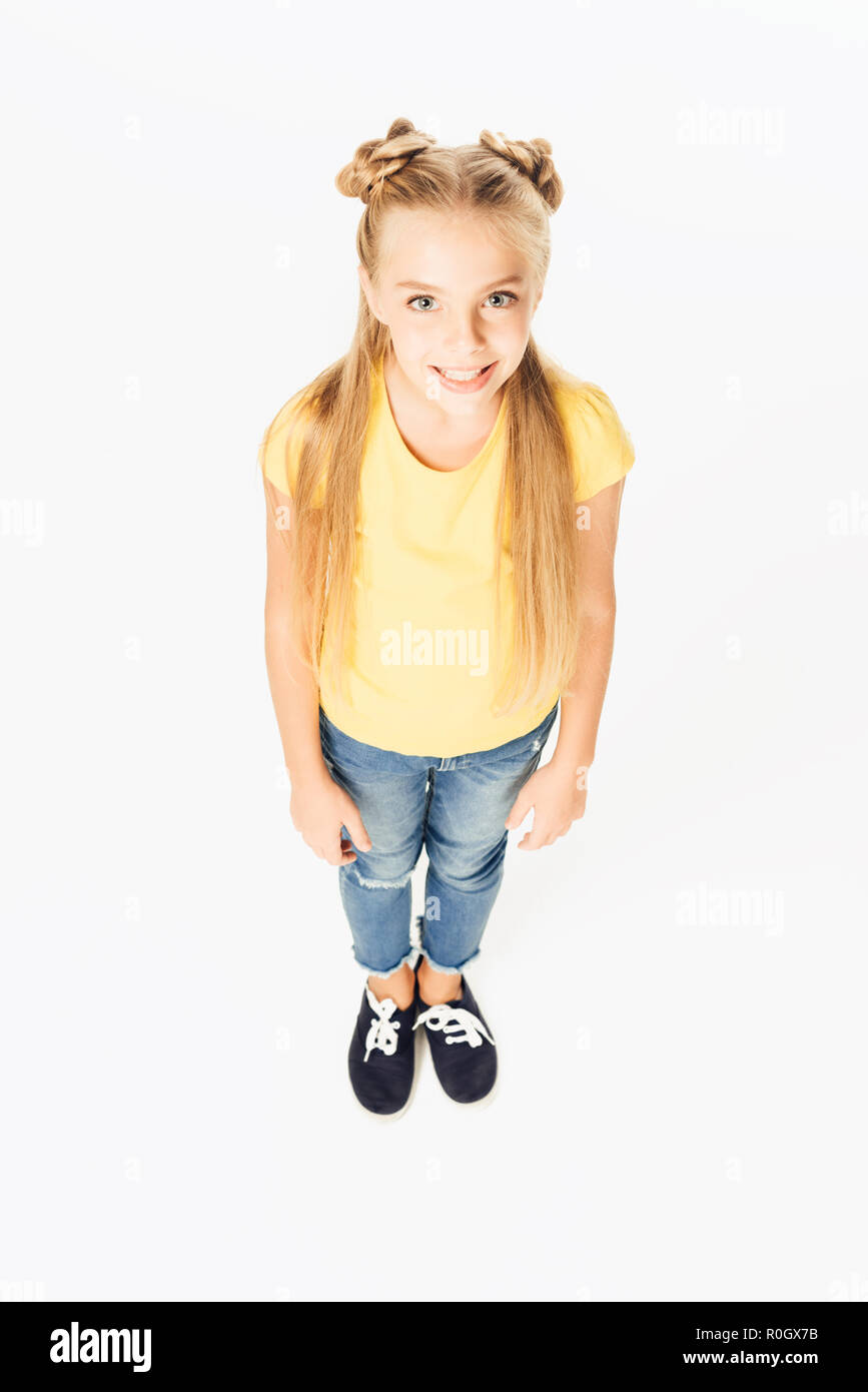 high angle view of beautiful happy child standing and smiling at camera ...