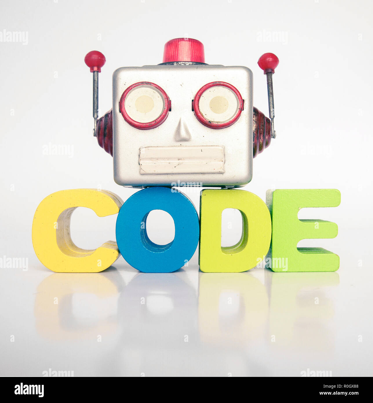silver robot head with the word CODE isolated on white Stock Photo - Alamy