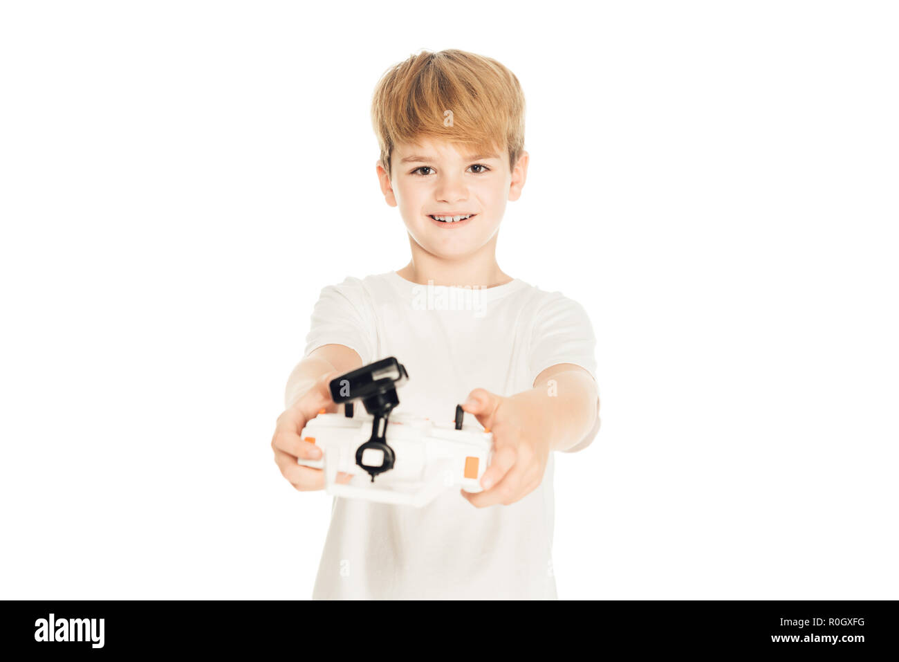 adorable boy holding remote control isolated on white Stock Photo - Alamy