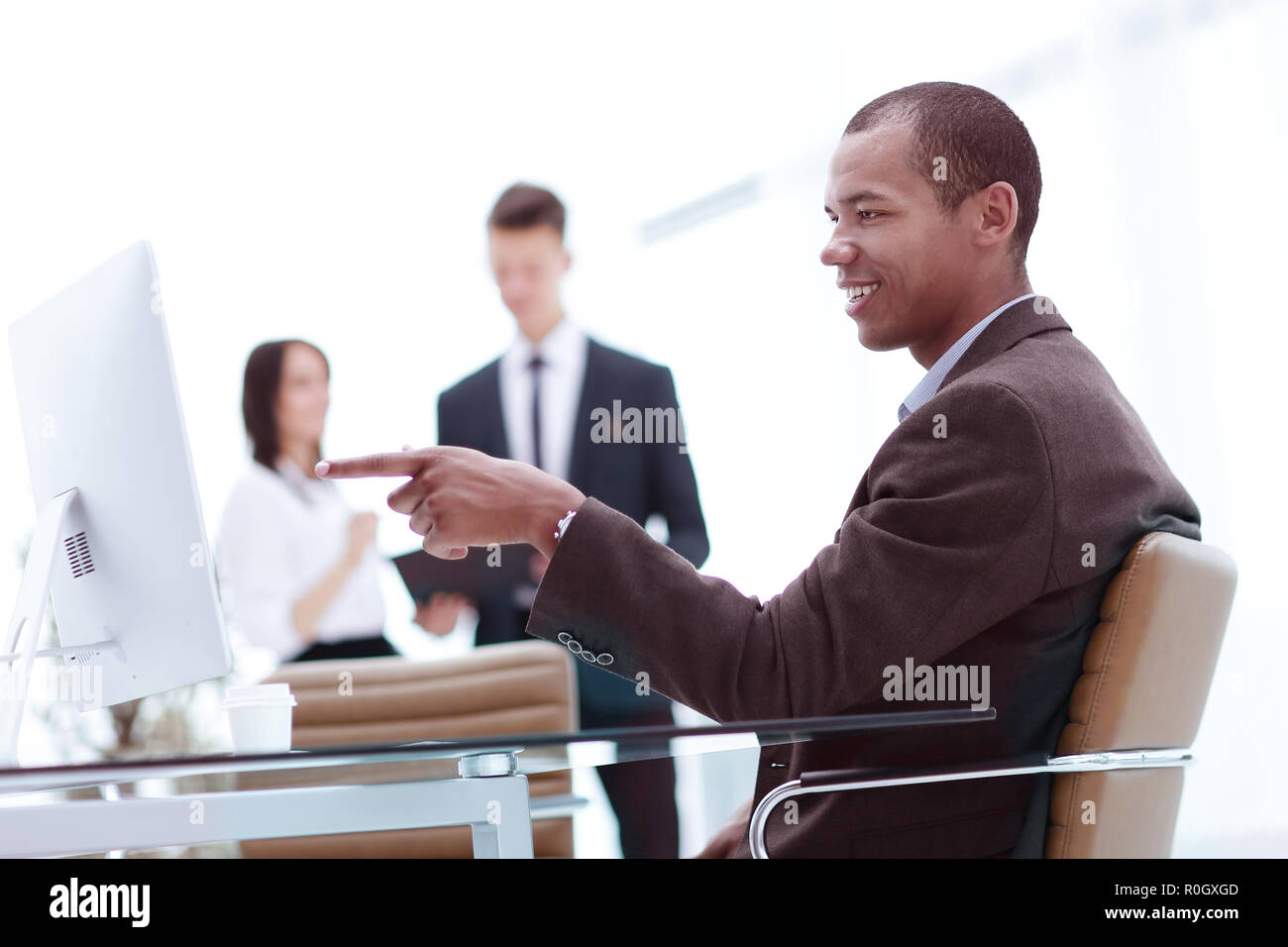 successful business man ,pointing a finger at the computer screen Stock ...