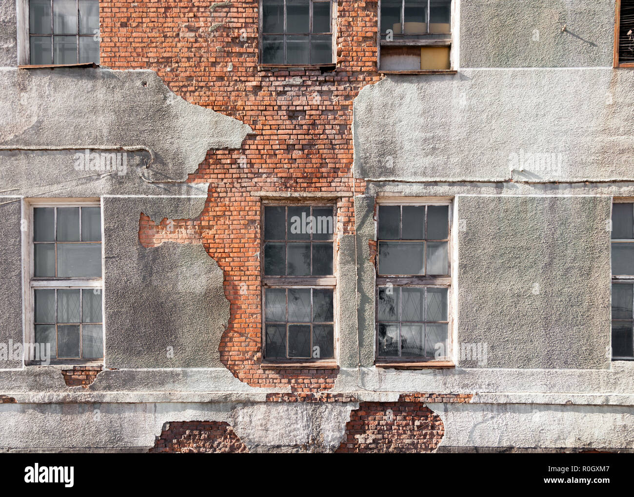 Destroyed building, red brick, gray concrete, window with old wooden ...