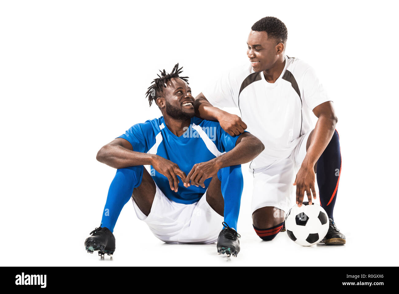happy african american soccer players smiling each other isolated on ...