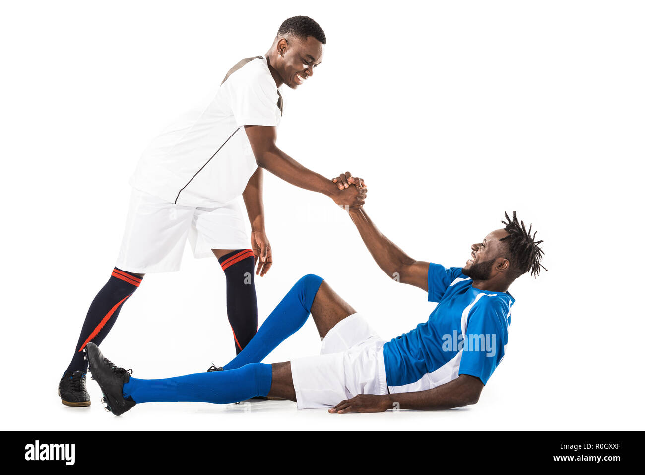 happy young african american sportsman helping soccer player isolated ...