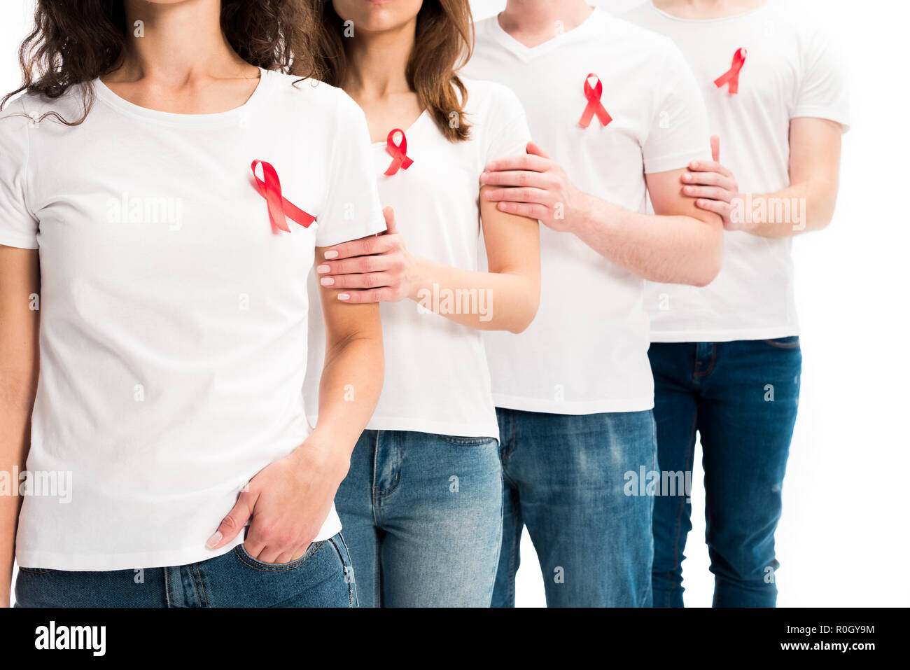 cropped image of people touching each other and standing with red ...