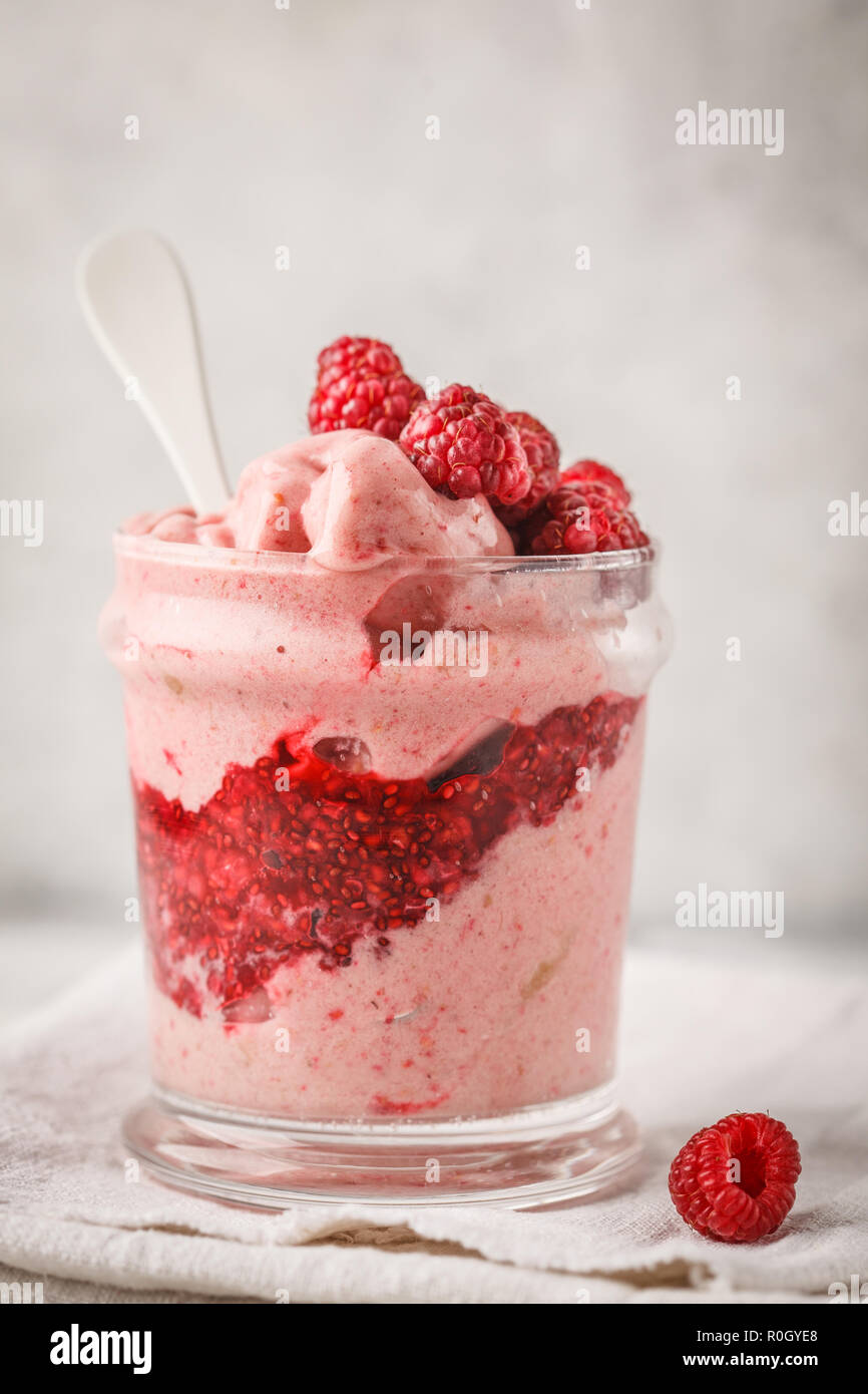 Vegan breakfast raspberry smoothie (ice cream) with berry jam in a jar ... Vegan breakfast raspberry smoothie (ice cream) with berry jam in a jar ...