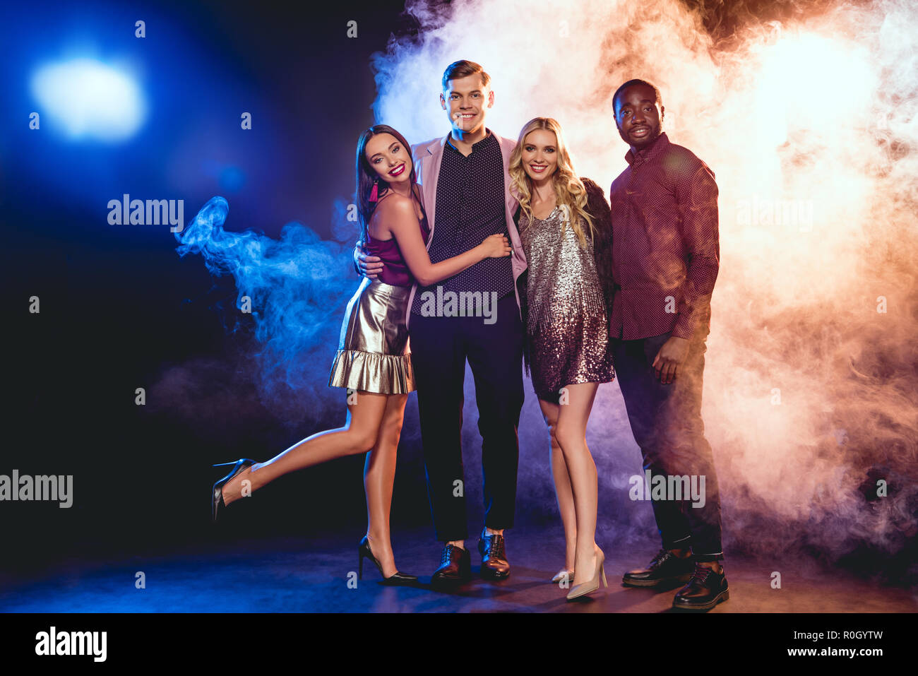 Smiling friends hugging hi-res stock photography and images - Alamy