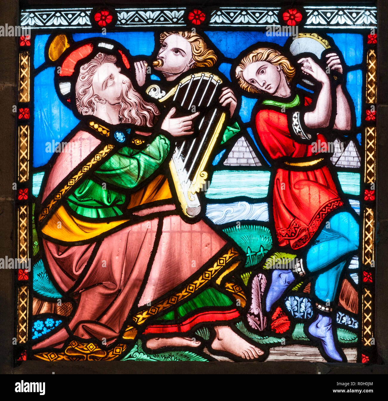 Hereford Cathedral, UK. Stained glass window showing King David playing ...