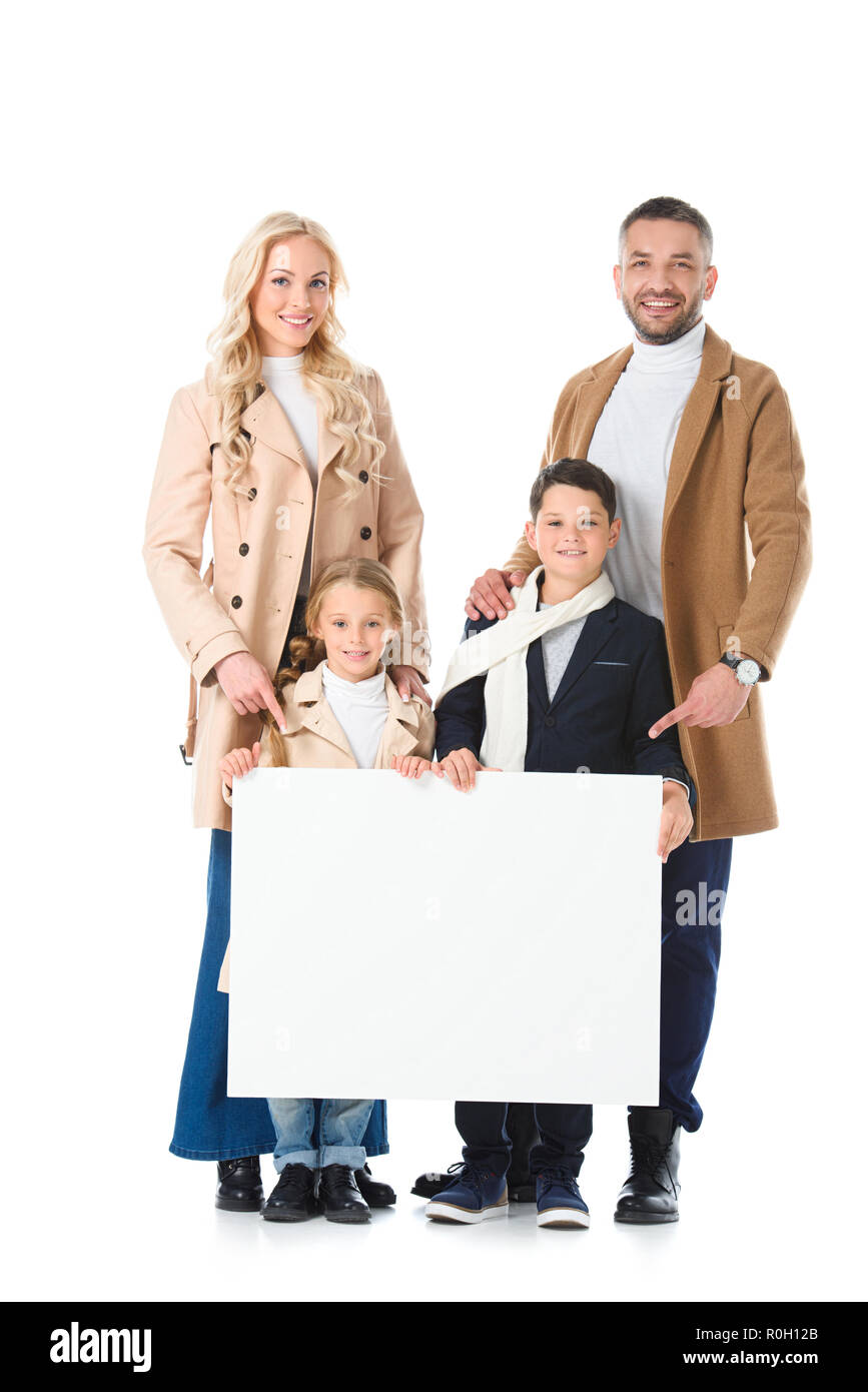 parents and kids in beige coats holding blank placard, isolated on ...