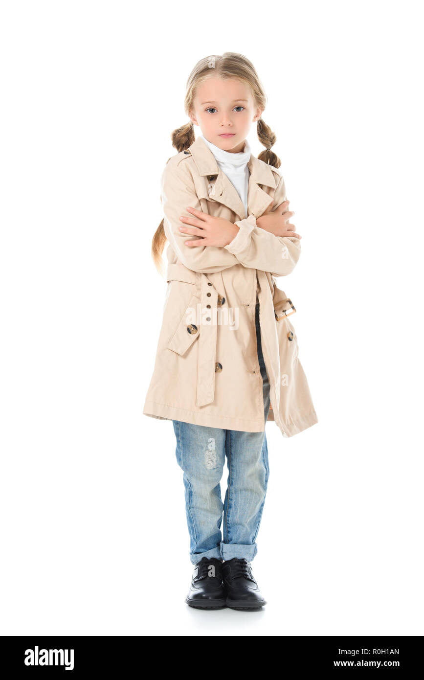 adorable child posing in beige coat, isolated on white Stock Photo - Alamy
