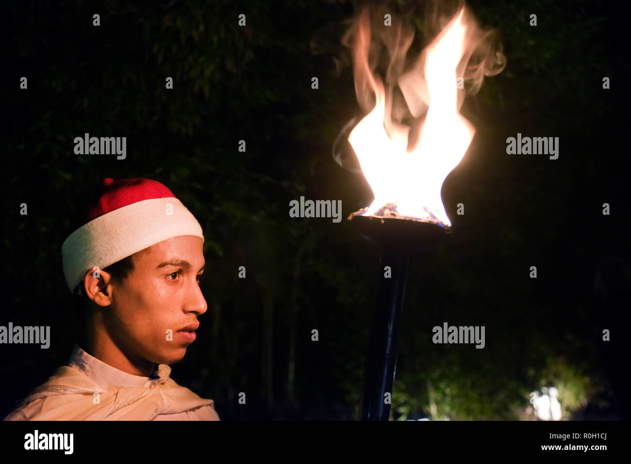 Portrait profile of a Moroccan boy in traditional clothes at night in ...