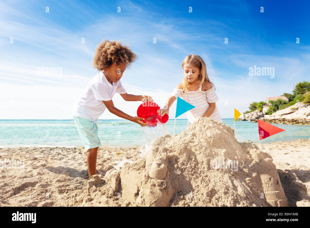 Boy building sandcastle hi-res stock photography and images - Alamy