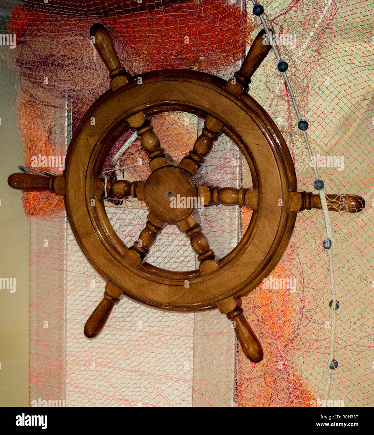 Steering wheel of a boat placed in the view Stock Photo - Alamy